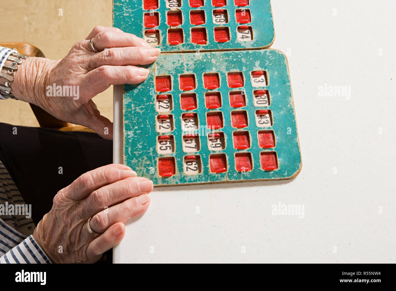 Senior woman playing bingo Stock Photo - Alamy