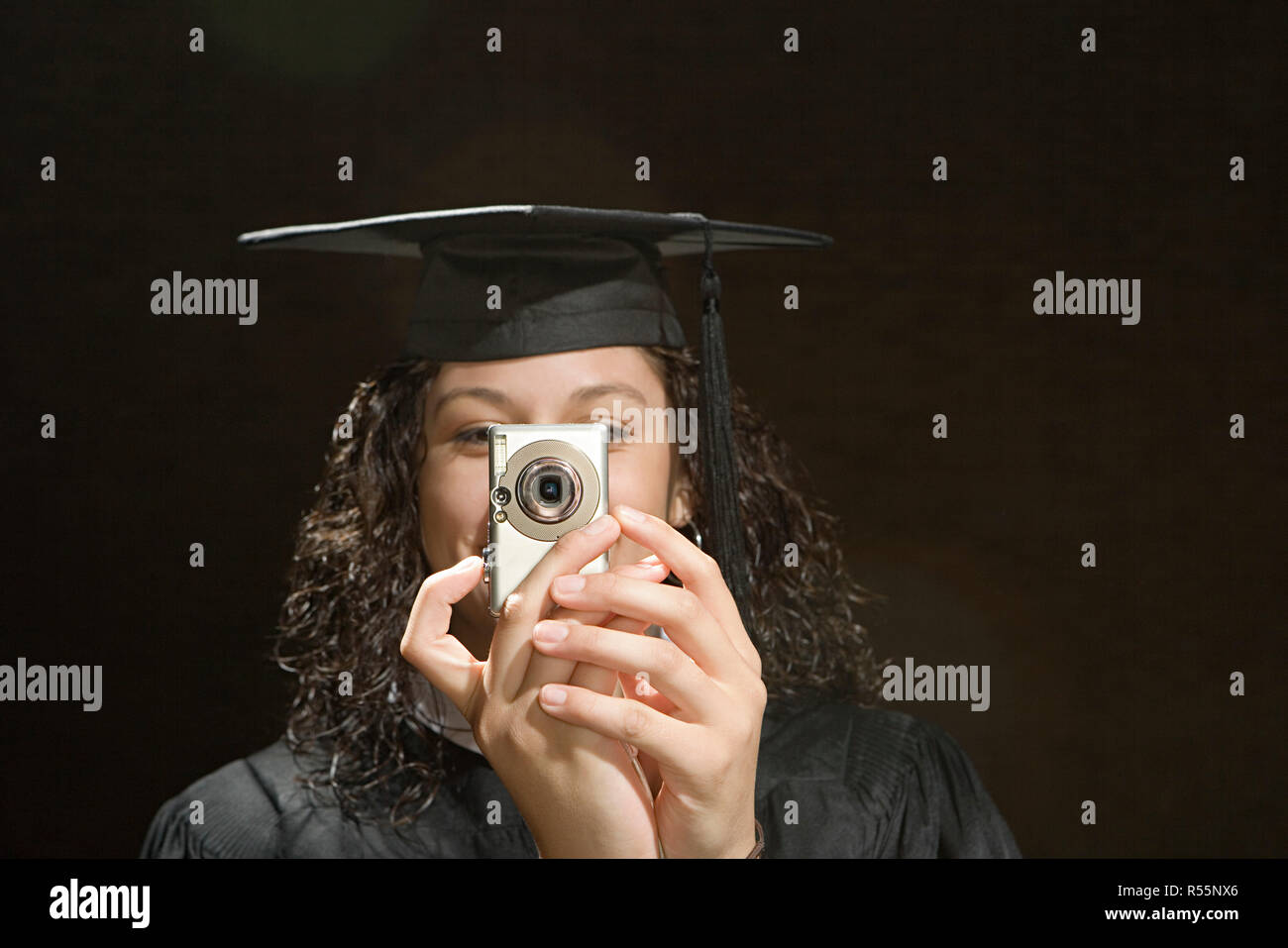Female graduate taking a photograph Stock Photo - Alamy
