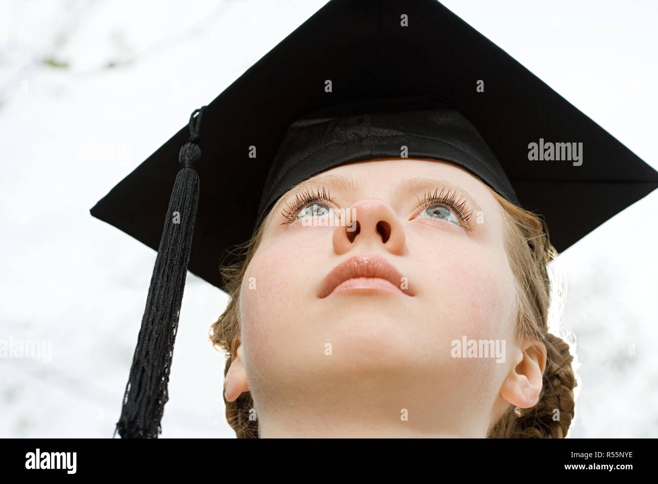 Female graduate looking up Stock Photo - Alamy