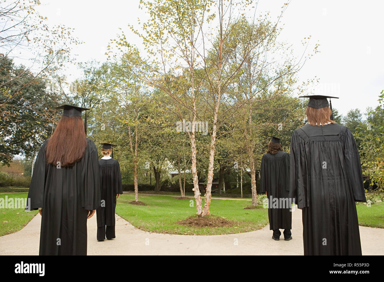 Female graduates walking down paths Stock Photo - Alamy