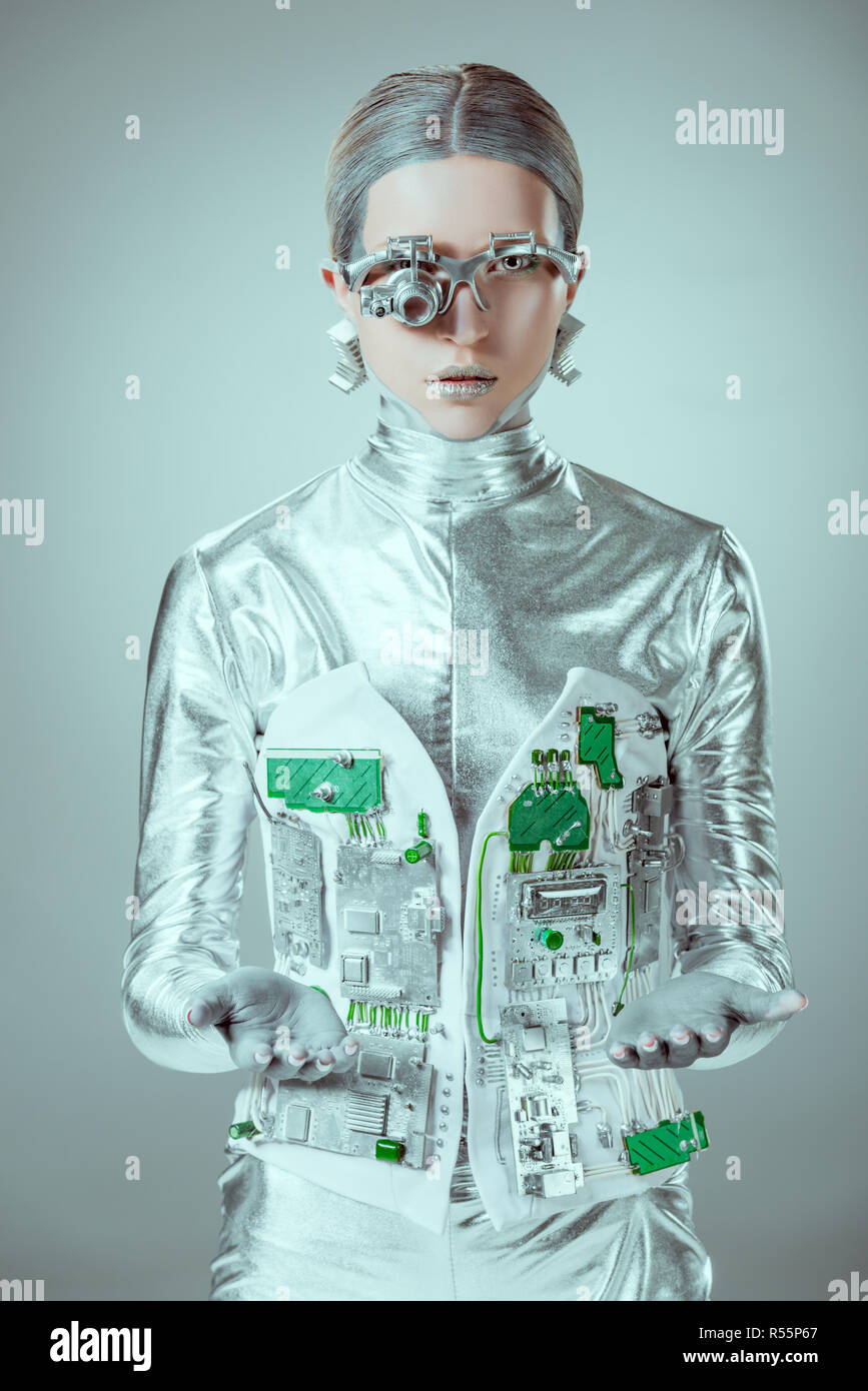 futuristic silver robot showing hands and looking at camera isolated on ...