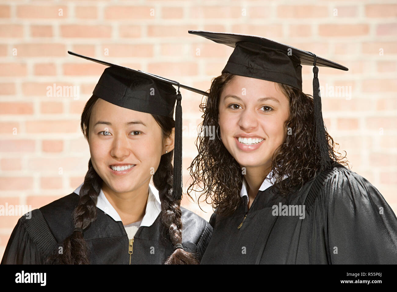 Two female graduates Stock Photo - Alamy