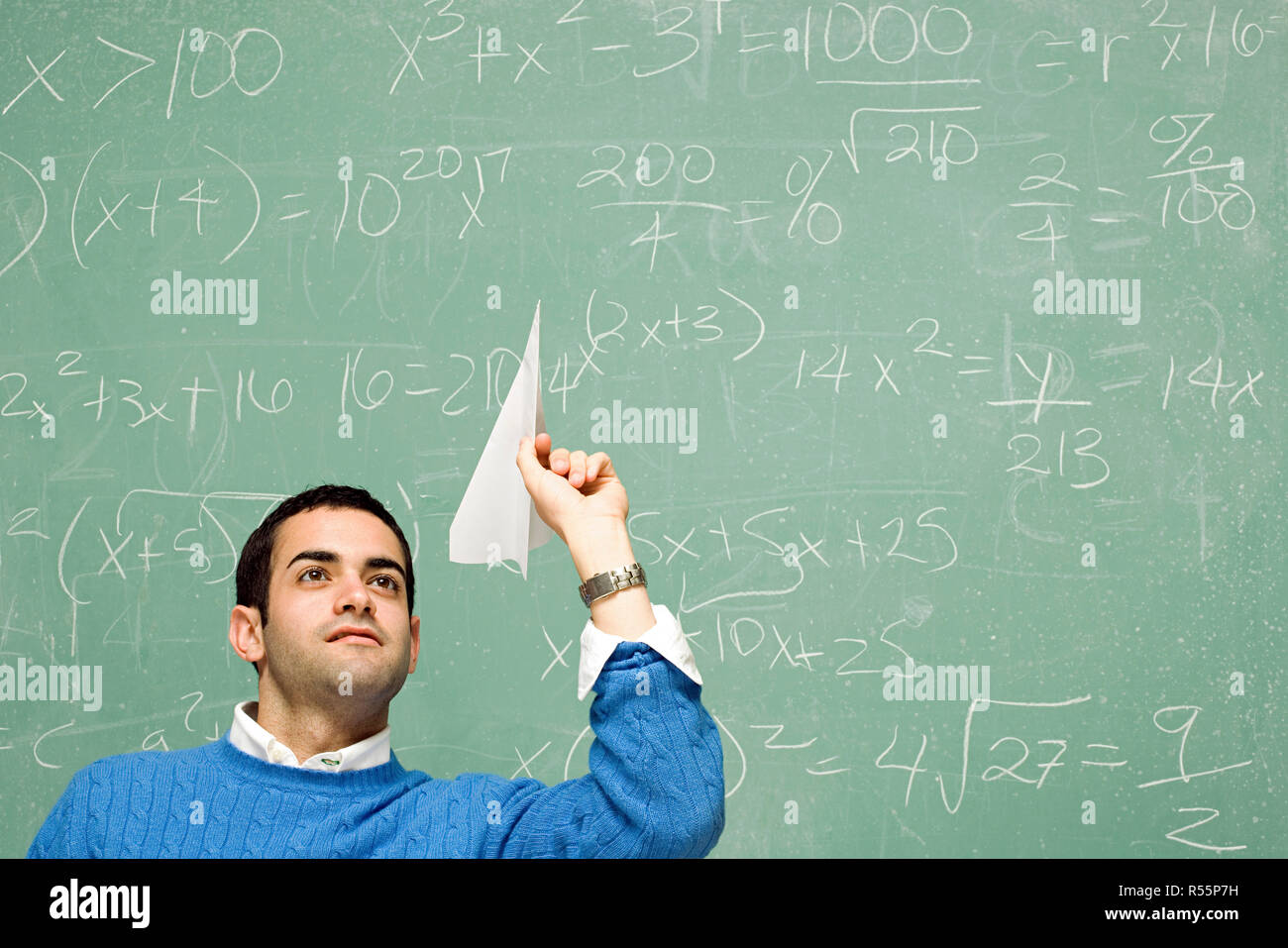 Male student throwing a paper aeroplane Stock Photo - Alamy