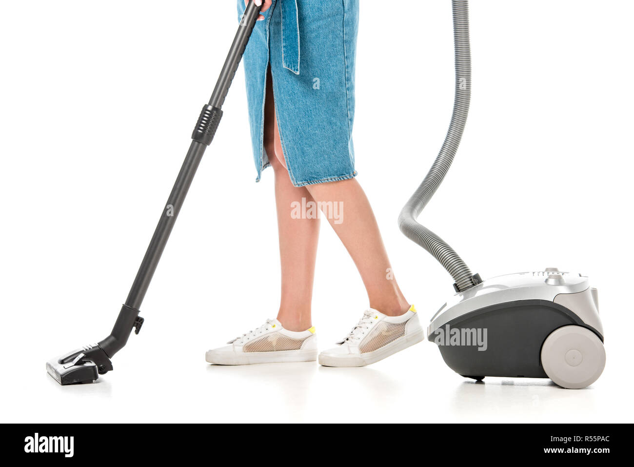Woman using vacuum cleaner hi-res stock photography and images - Alamy