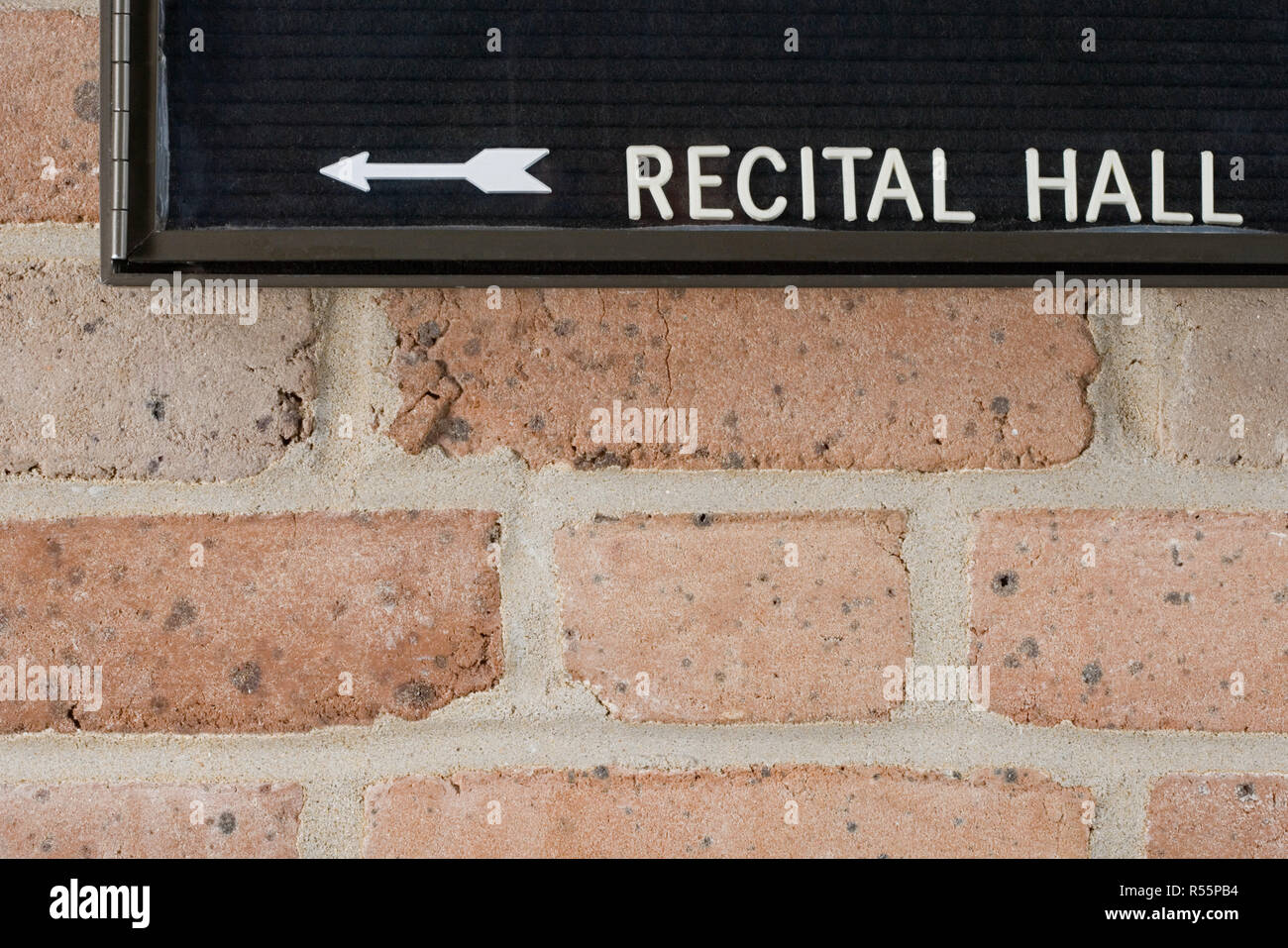 Recital hall sign on brick wall Stock Photo - Alamy