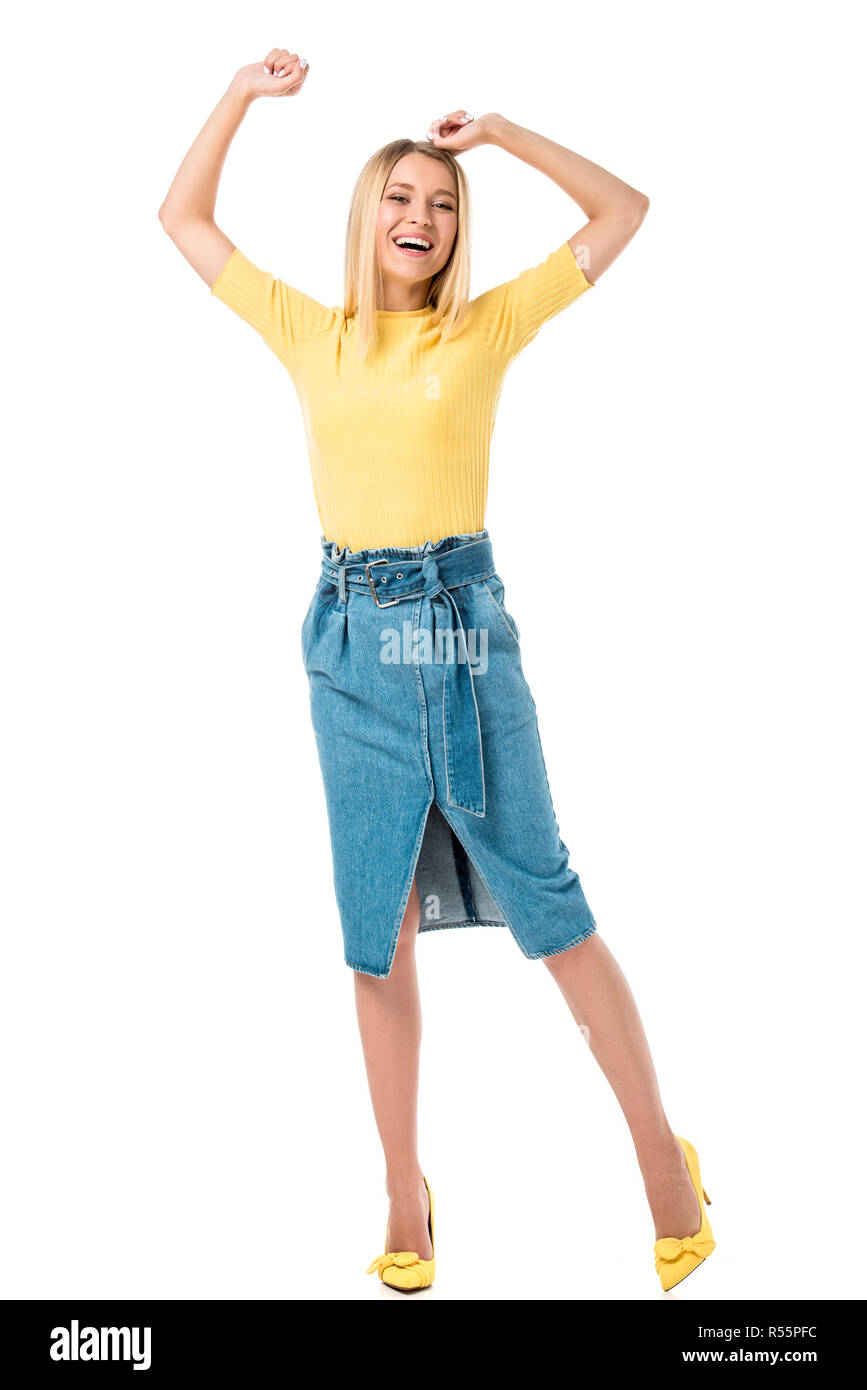 full length view of beautiful happy young woman raising hands and ...