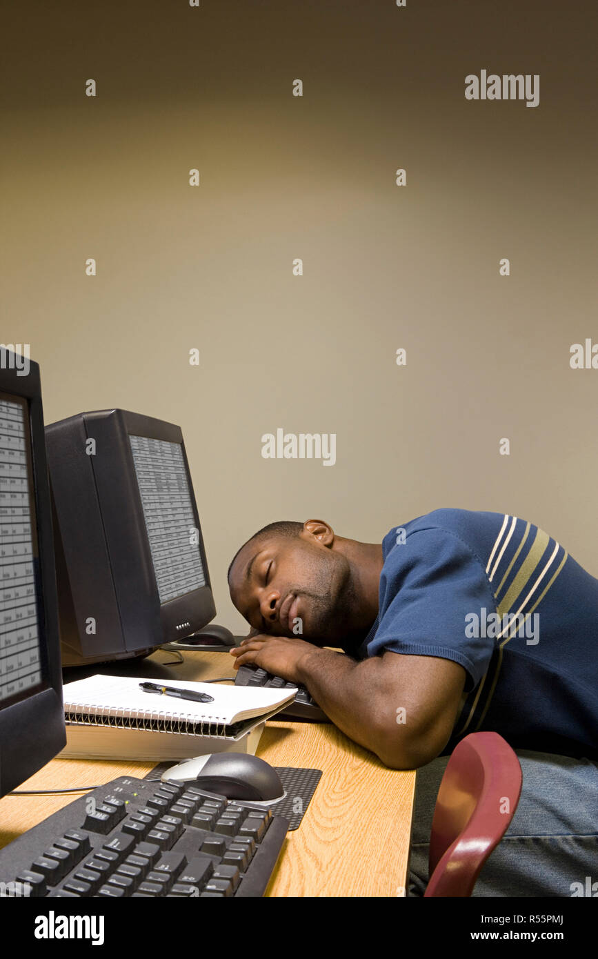 Male student sleeping at his computer Stock Photo - Alamy