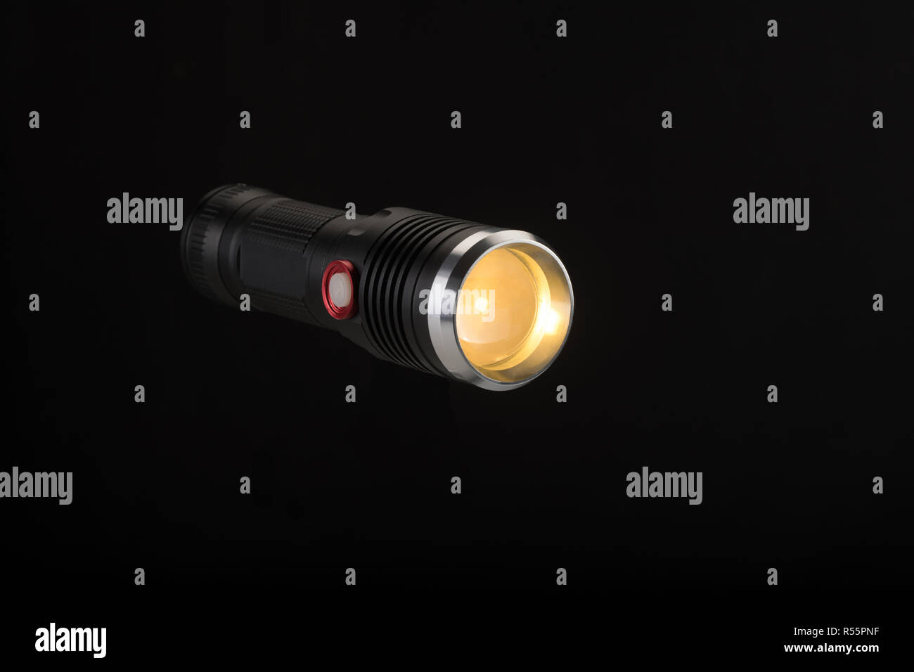 Tactical flashlight, hand on black background, studio light Stock Photo ...