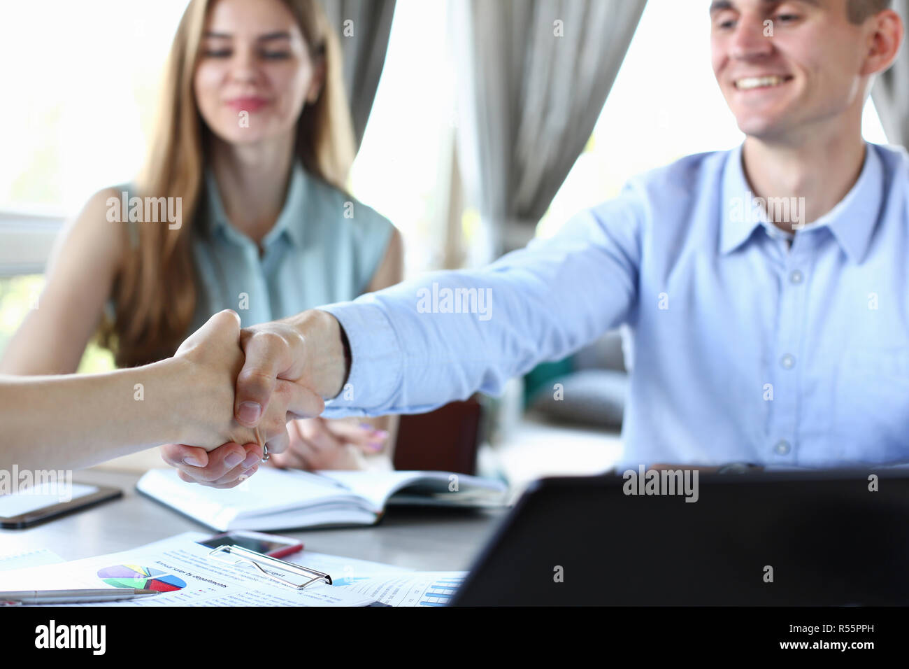 young businessmen make deal handshake Stock Photo - Alamy