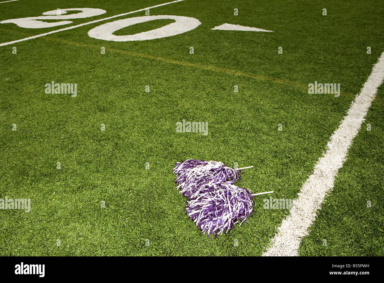 Cheerleading pom-poms on football field Stock Photo - Alamy