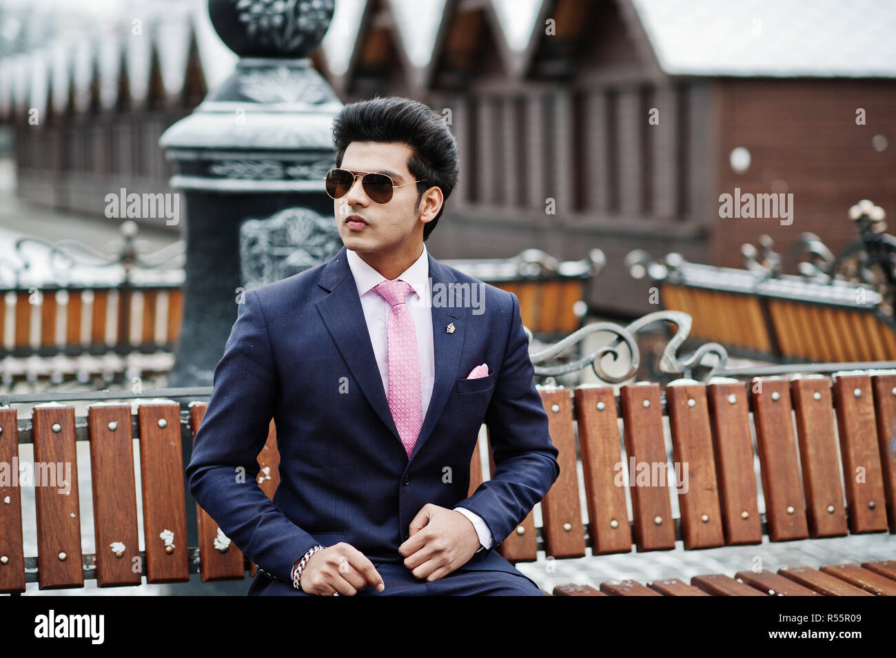 Elegant indian macho man model on suit and pink tie, sunglasses posed ...