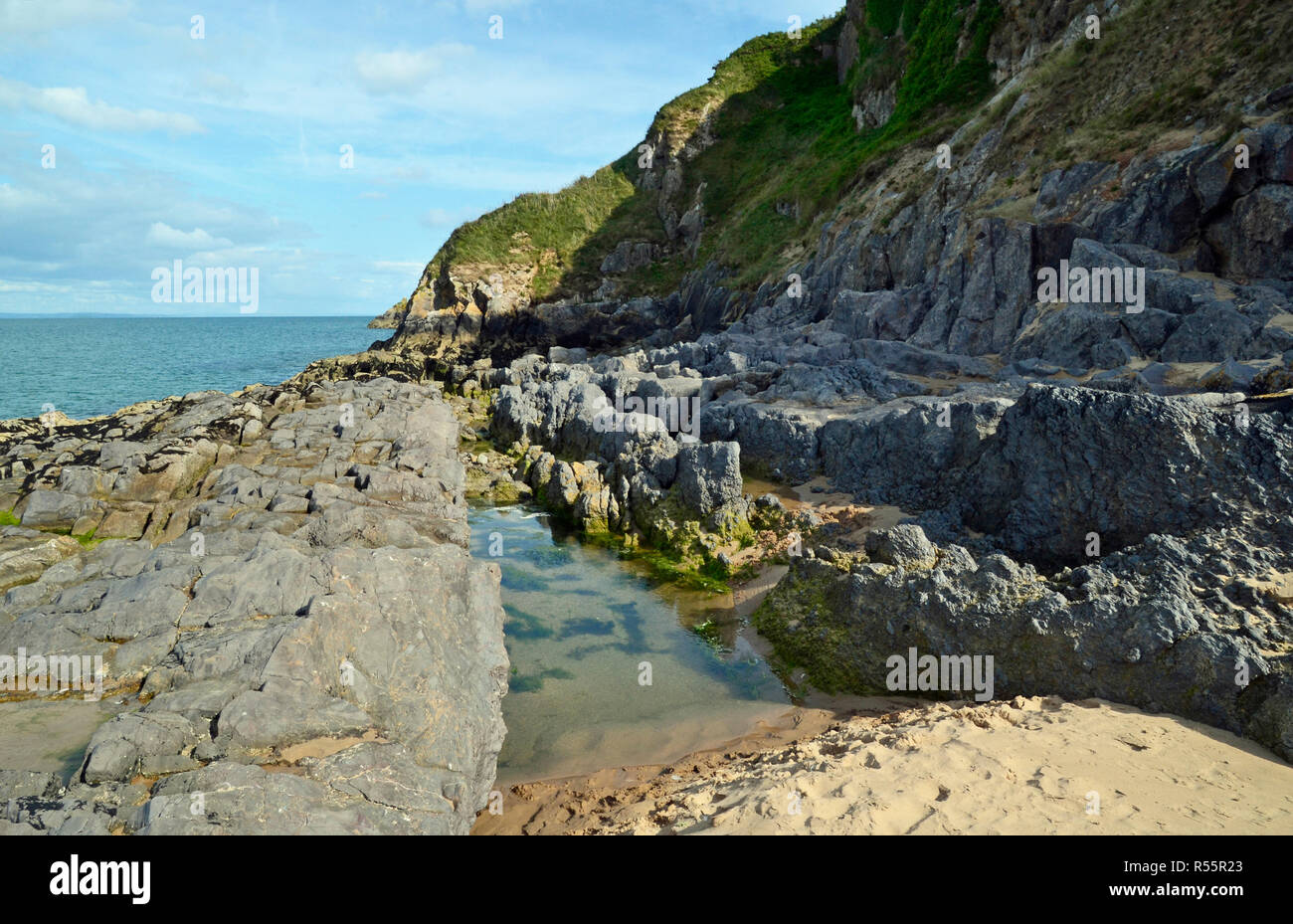 Rock pools on the beach at Caldey Island, near Tenby, Wales, UK Stock ...