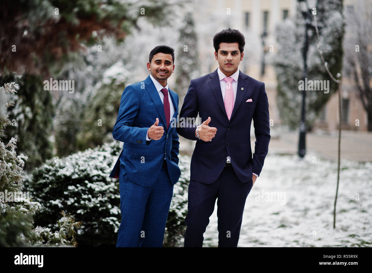 Two elegant indian fashionable mans model on suit posed at winter day ...