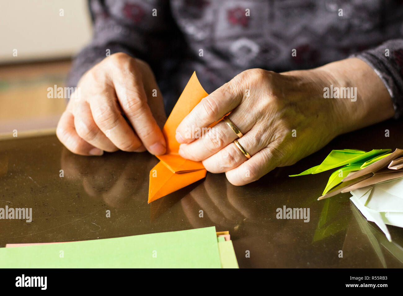 Woman folding paper origami hi-res stock photography and images - Alamy