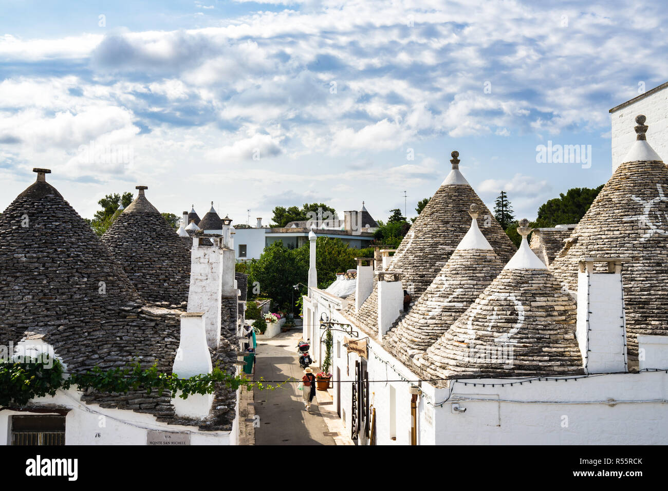 The trulli of Alberobello, with conical roof composed of overlapping ...
