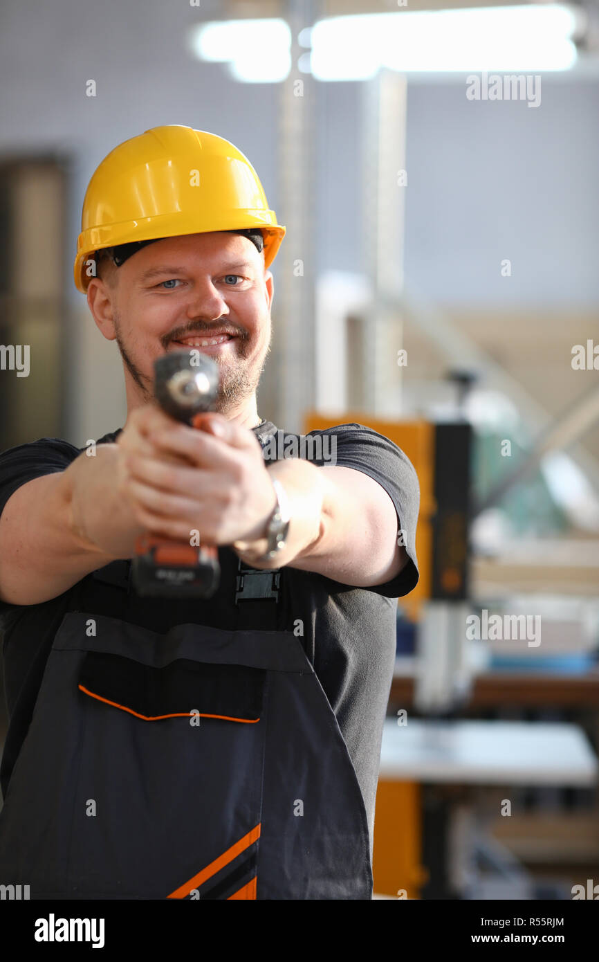Worker using drill create hi-res stock photography and images - Alamy