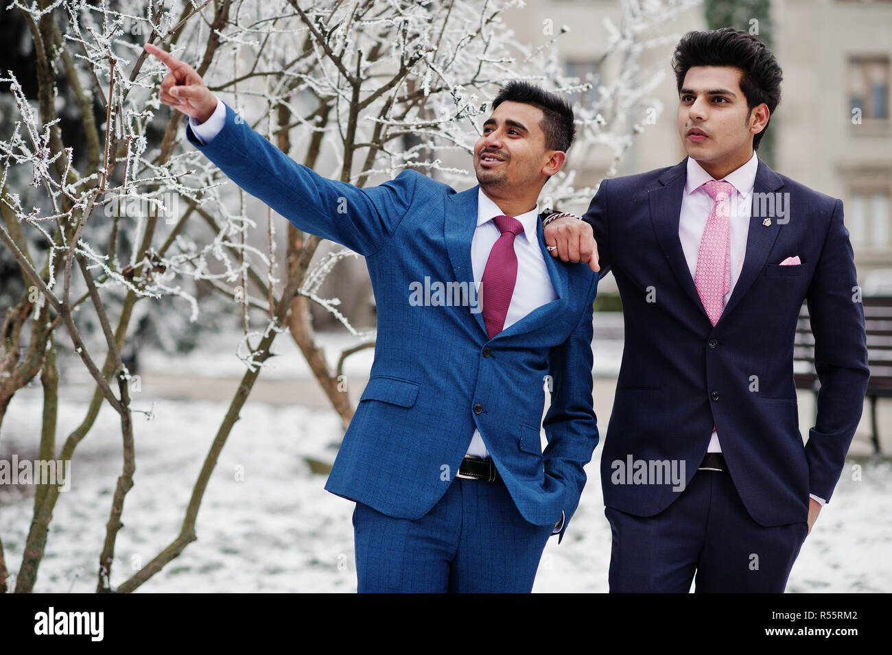 Two elegant indian fashionable mans model on suit posed at winter day ...