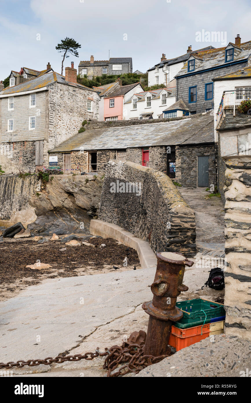 Stone fishermen's huts at the Cornish fishing port of Port Isaac with a ...