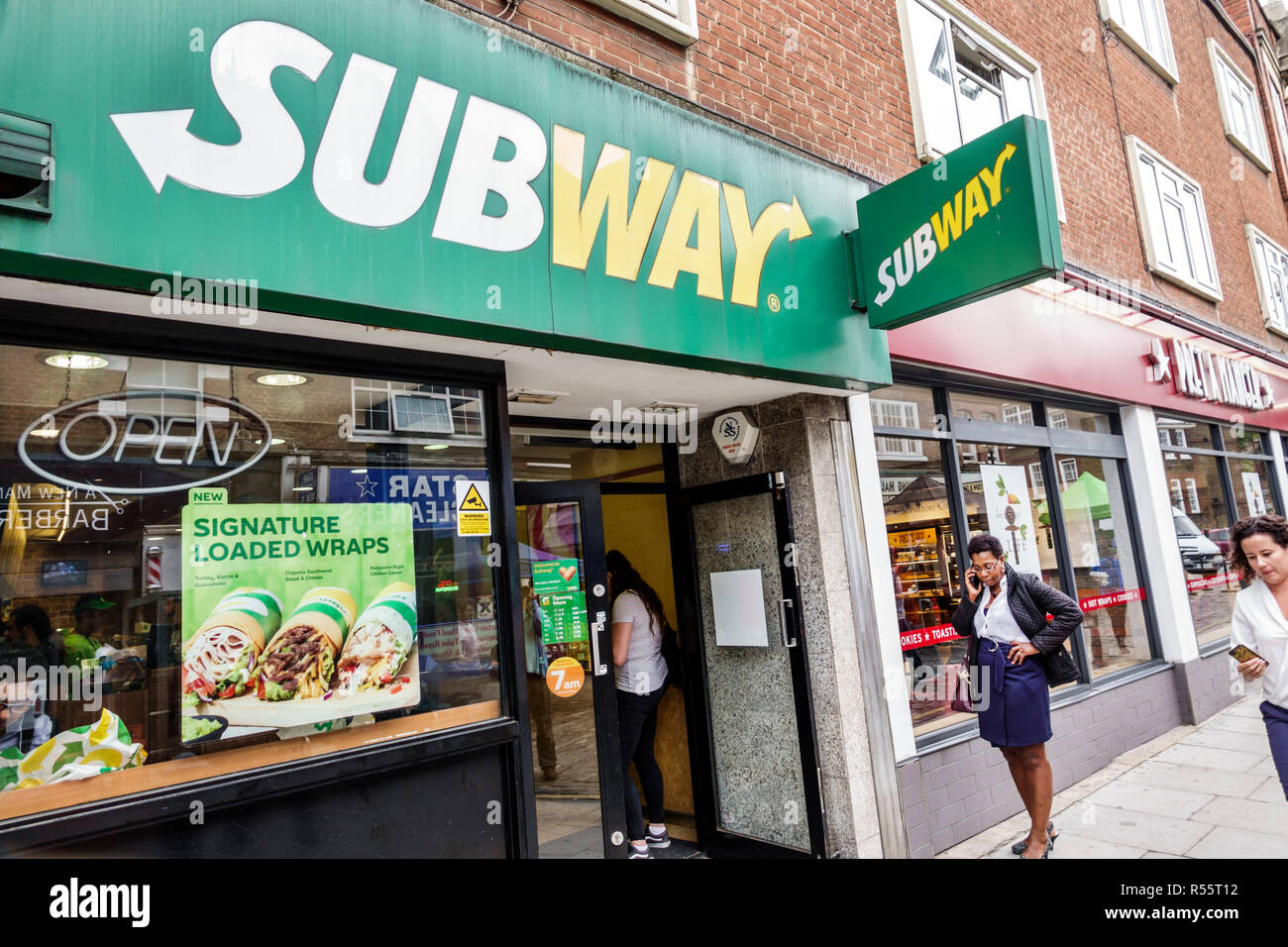 Woman eating sandwich in subway hi-res stock photography and images - Alamy