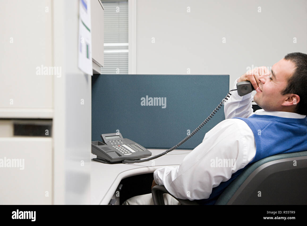 Office worker on telephone Stock Photo - Alamy