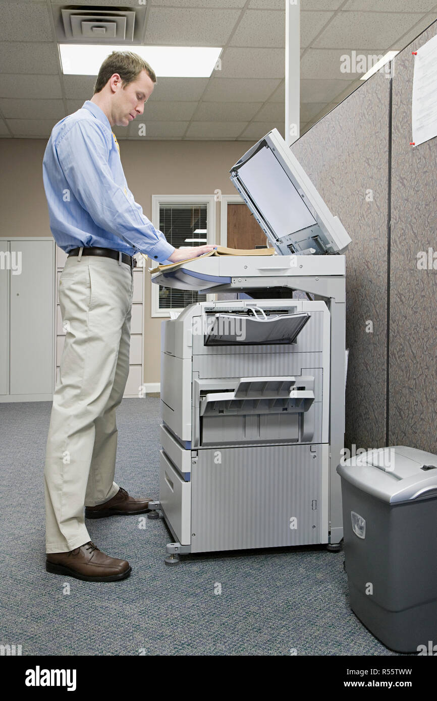 Photocopying man hi-res stock photography and images - Alamy