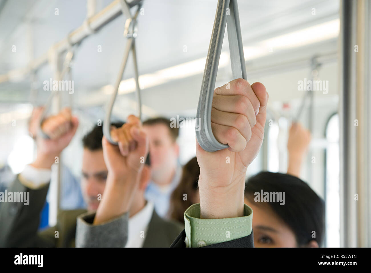 Commuters on light rail Stock Photo - Alamy