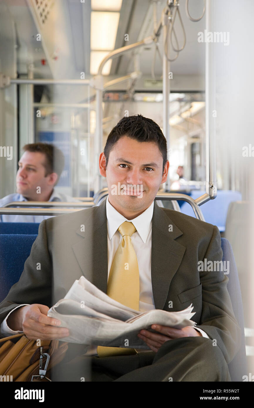 Businessman on train Stock Photo - Alamy