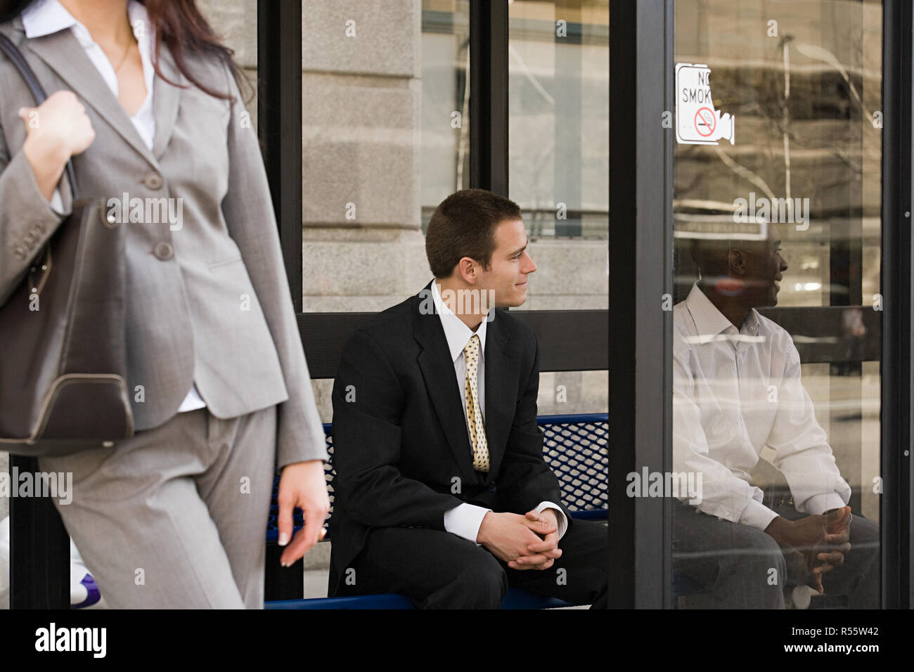 People waiting at bus stop Stock Photo - Alamy