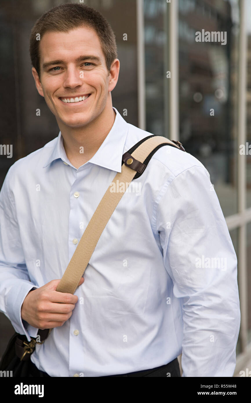 Office worker smiling Stock Photo - Alamy