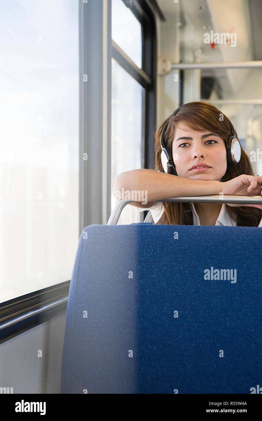 Wearing headphones on train hi-res stock photography and images - Alamy
