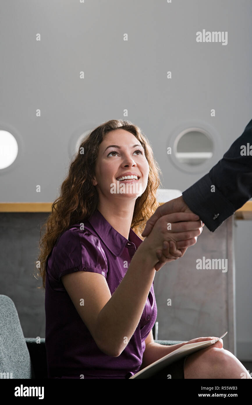 Woman shaking hands Stock Photo - Alamy