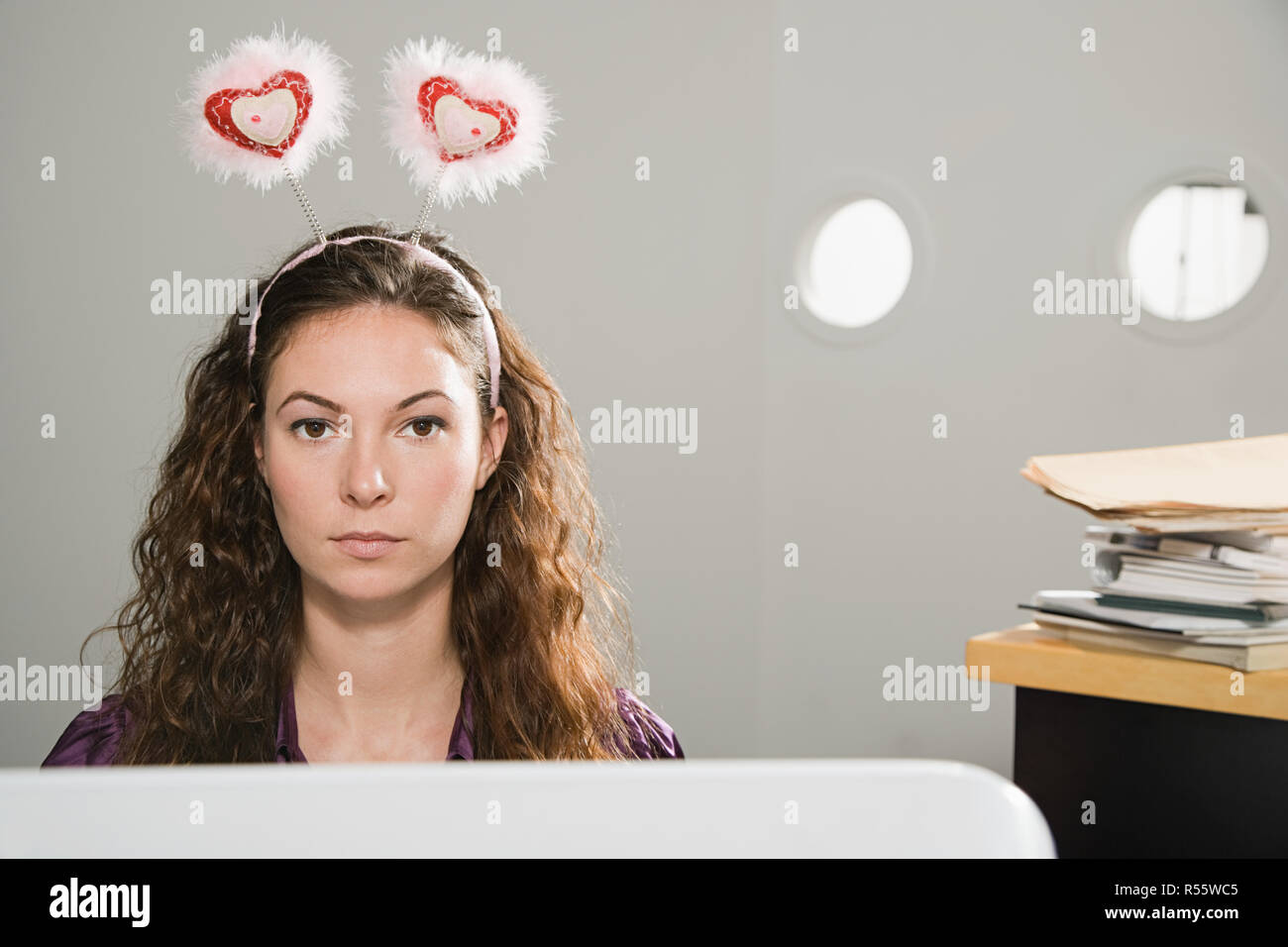 Office worker wearing deely bopper Stock Photo - Alamy
