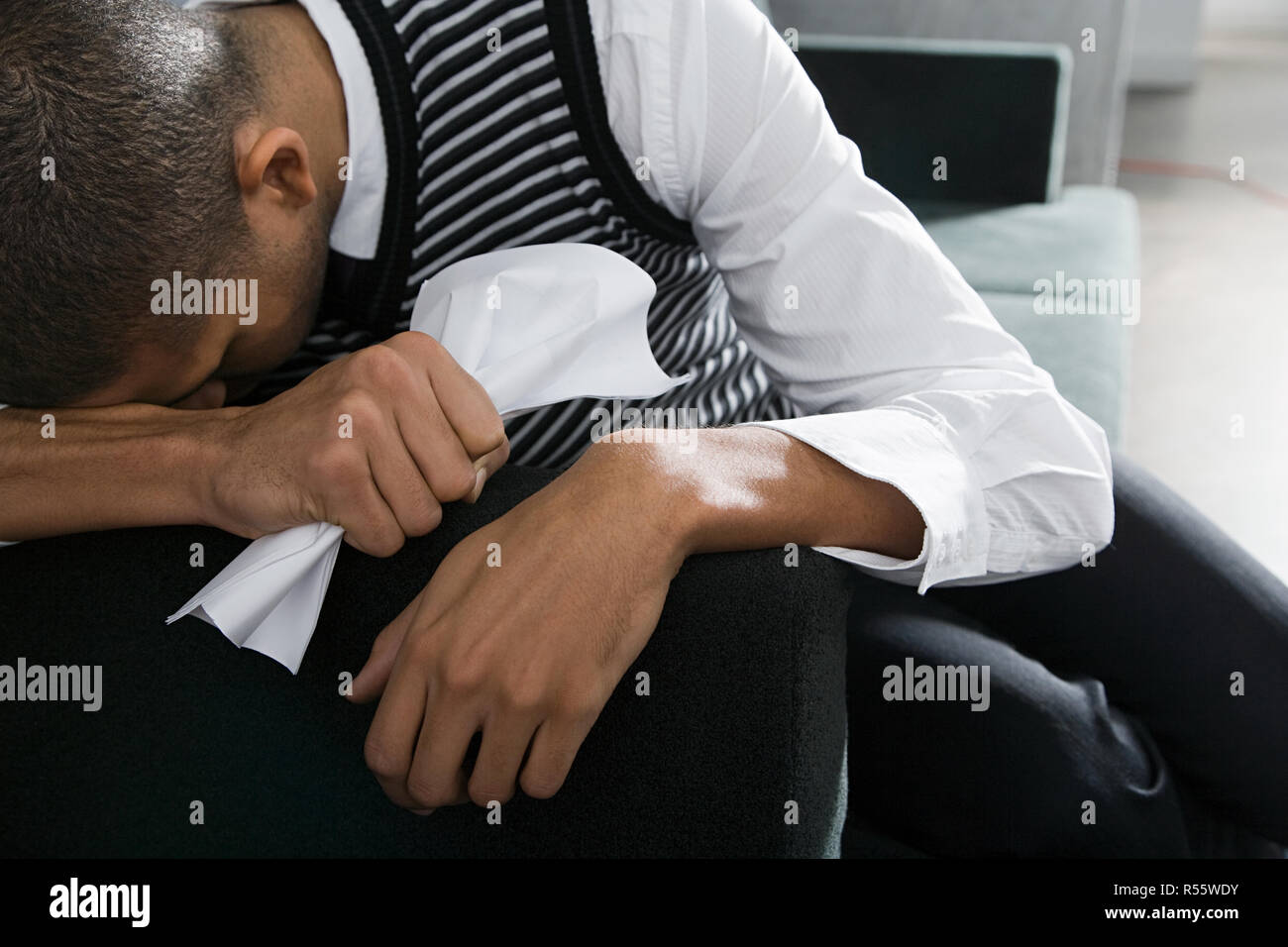Despairing office worker Stock Photo - Alamy