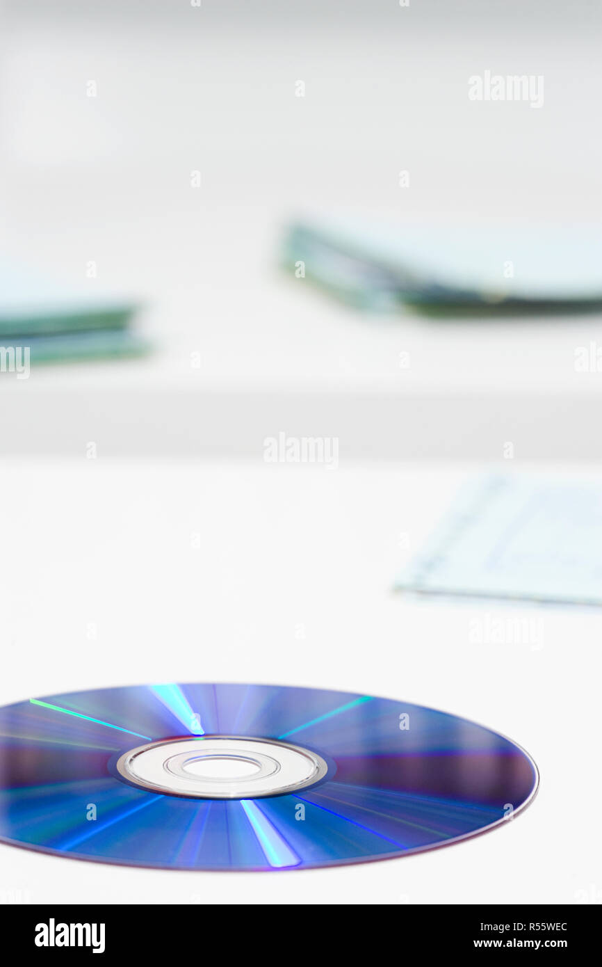 Compact disc on desk Stock Photo - Alamy