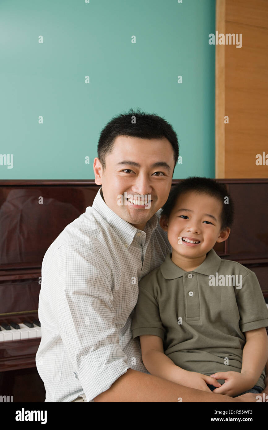 Portrait of a father and son Stock Photo - Alamy