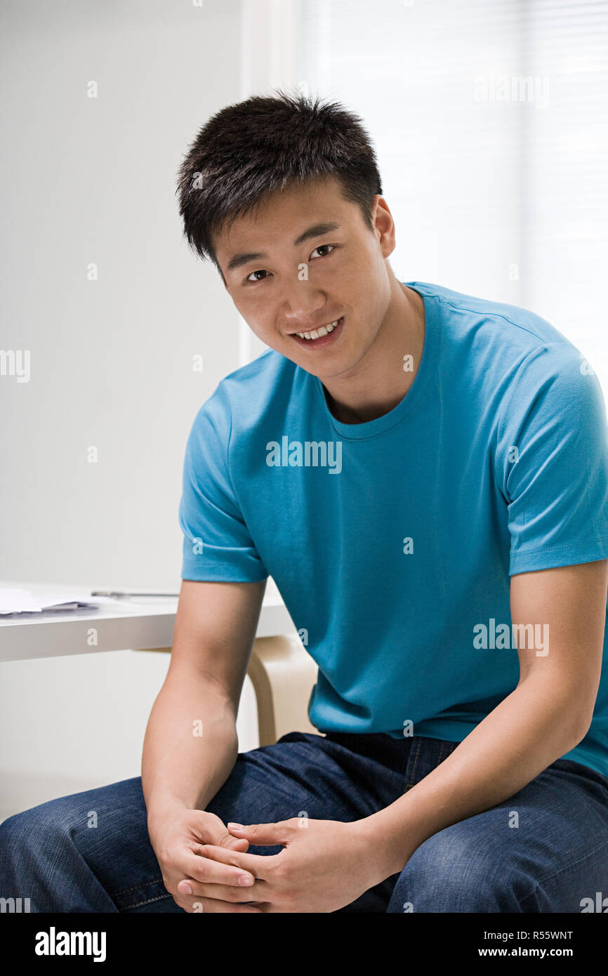 Portrait friendly chinese man sitting hi-res stock photography and ...
