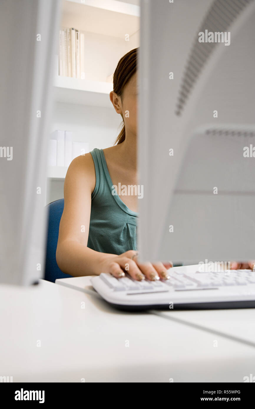 Woman working on computer Stock Photo - Alamy