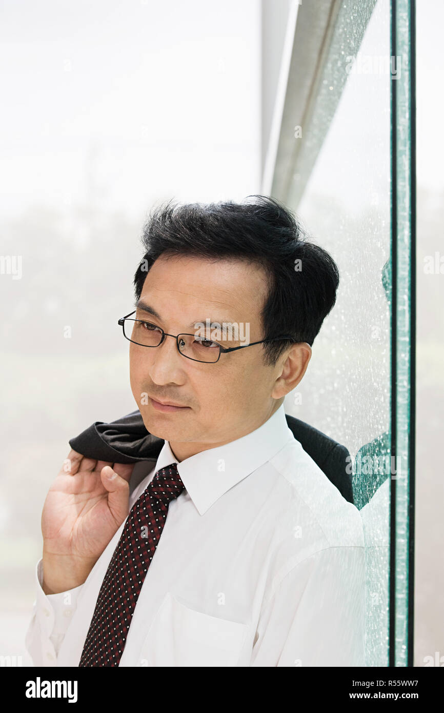 Serious looking businessman Stock Photo - Alamy