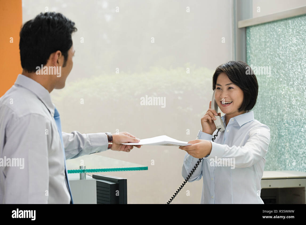 Two Chinese office workers Stock Photo - Alamy