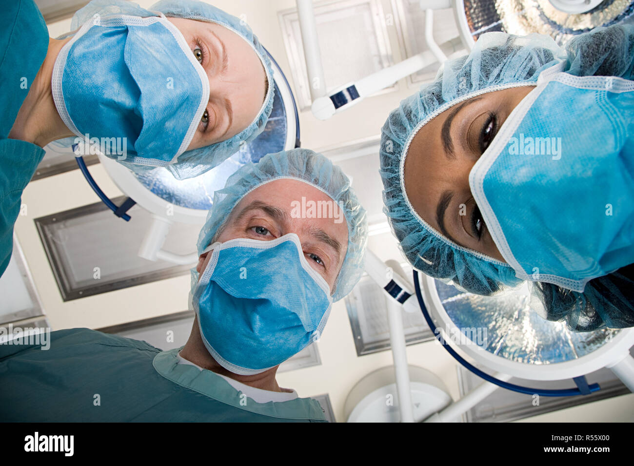 Surgeons looking down Stock Photo - Alamy