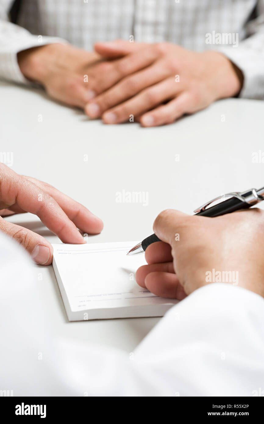 Doctor writes prescription treatment disease hi-res stock photography ...