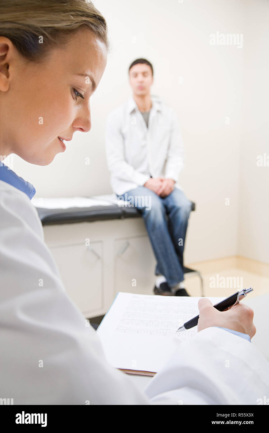 Professional doctor checking medical records hi-res stock photography ...