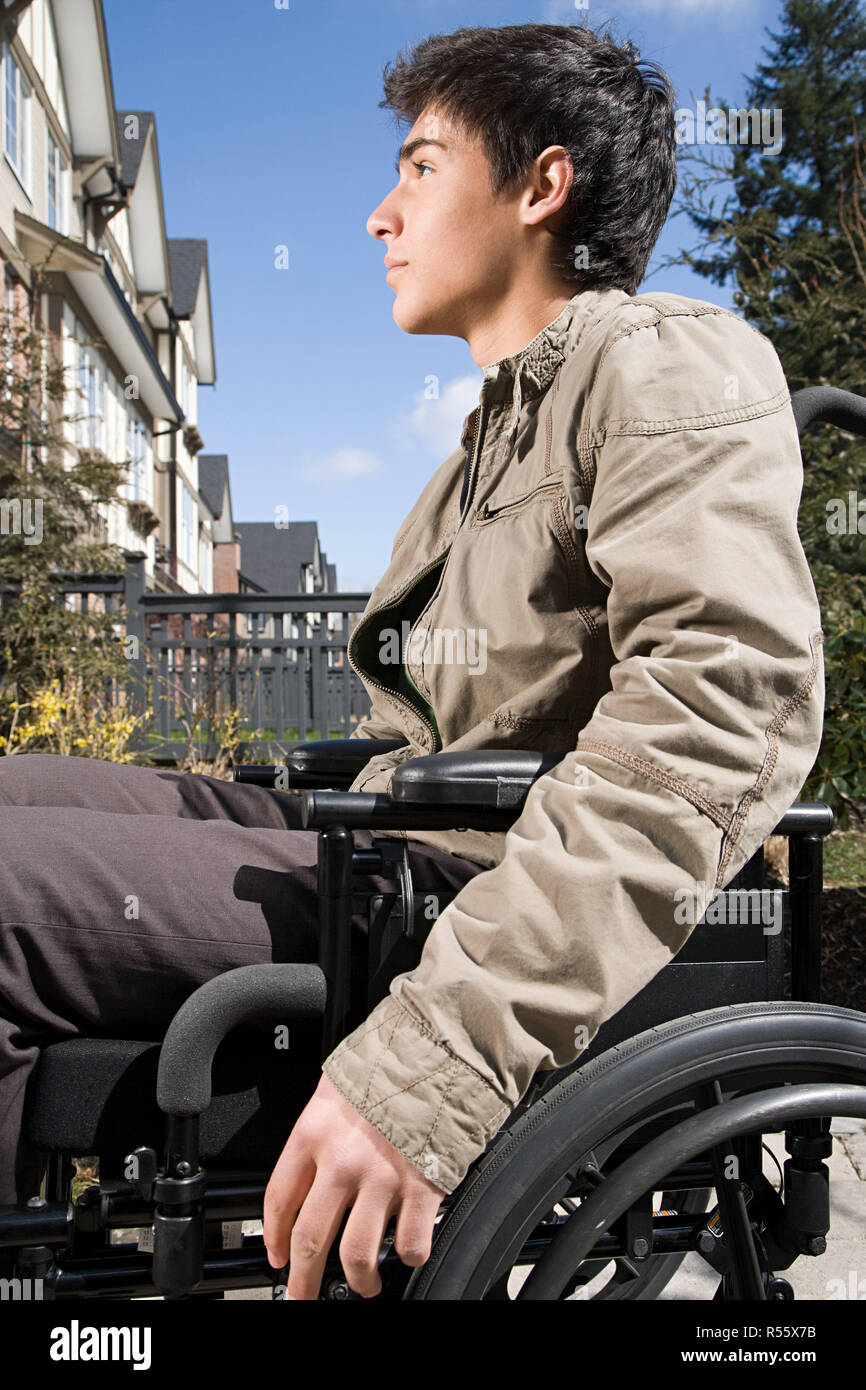 Profile of a disabled teenage boy Stock Photo - Alamy