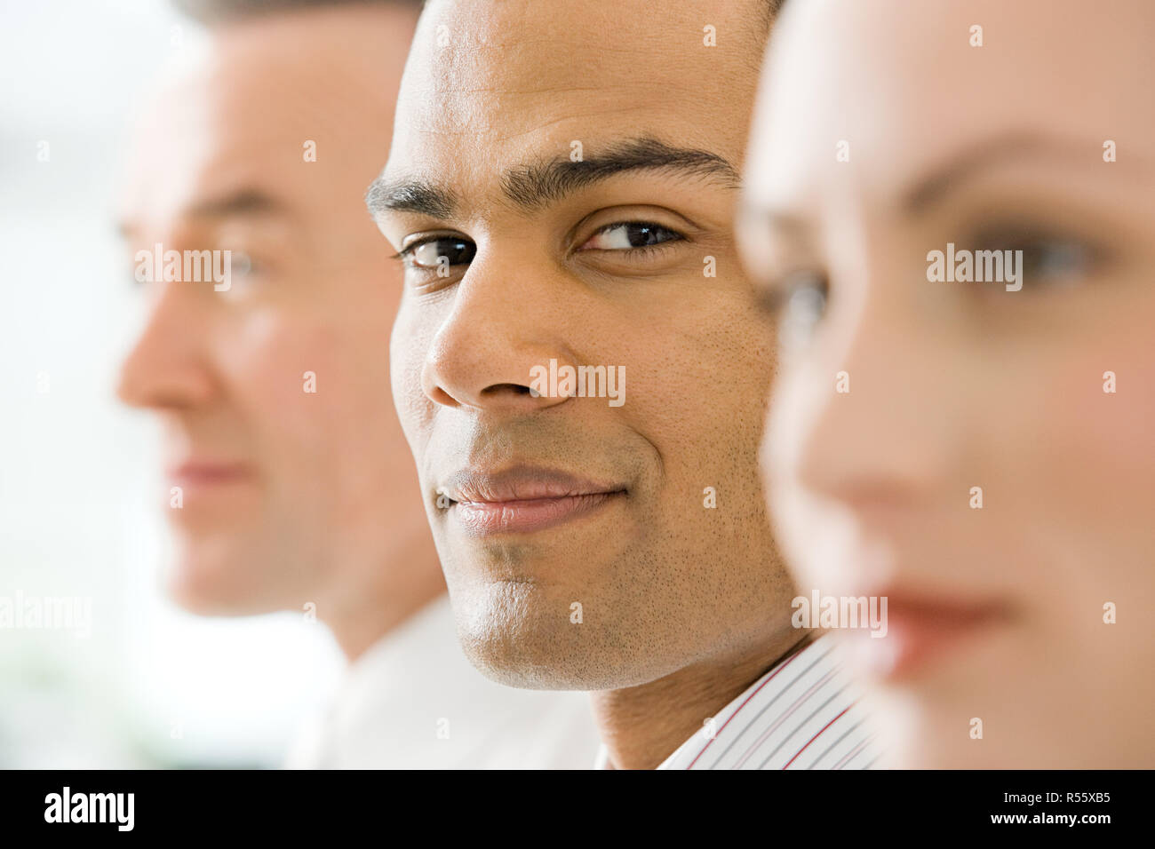 Three faces in a row Stock Photo - Alamy