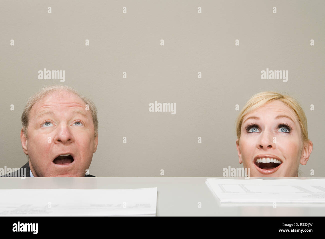 Office workers looking up in surprise Stock Photo - Alamy
