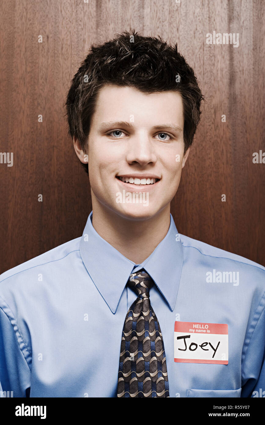 Businessman wearing name tag Stock Photo - Alamy