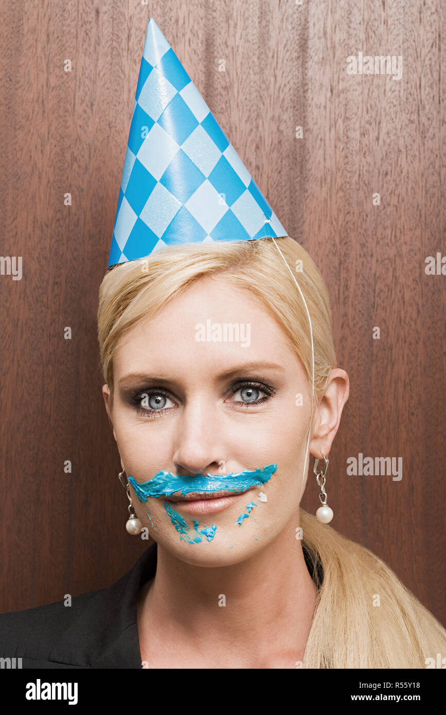 Businesswoman with icing on her face Stock Photo - Alamy