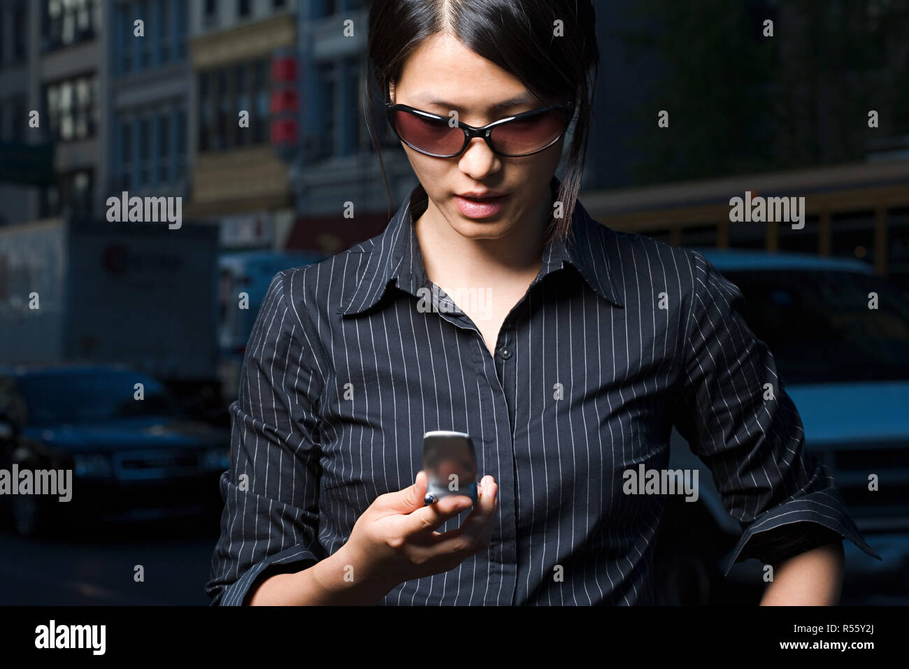 Woman looking at text message Stock Photo - Alamy