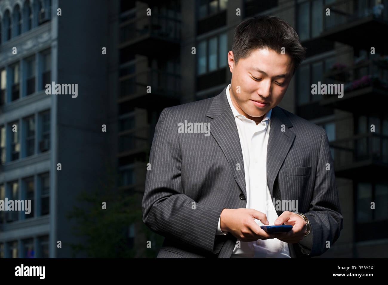 Man using handheld computer Stock Photo - Alamy