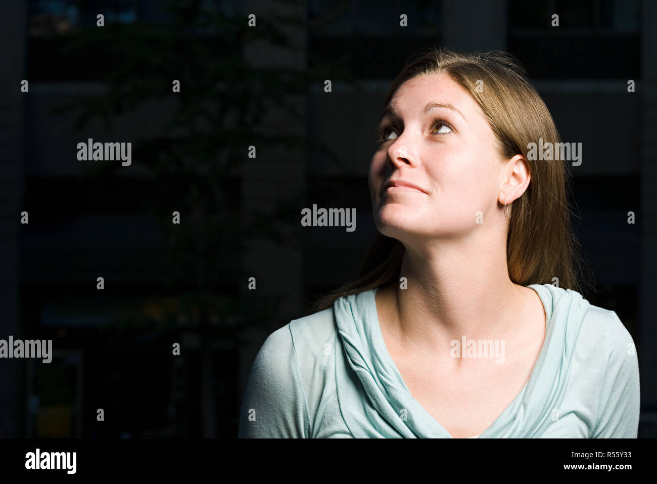 Woman looking up Stock Photo - Alamy
